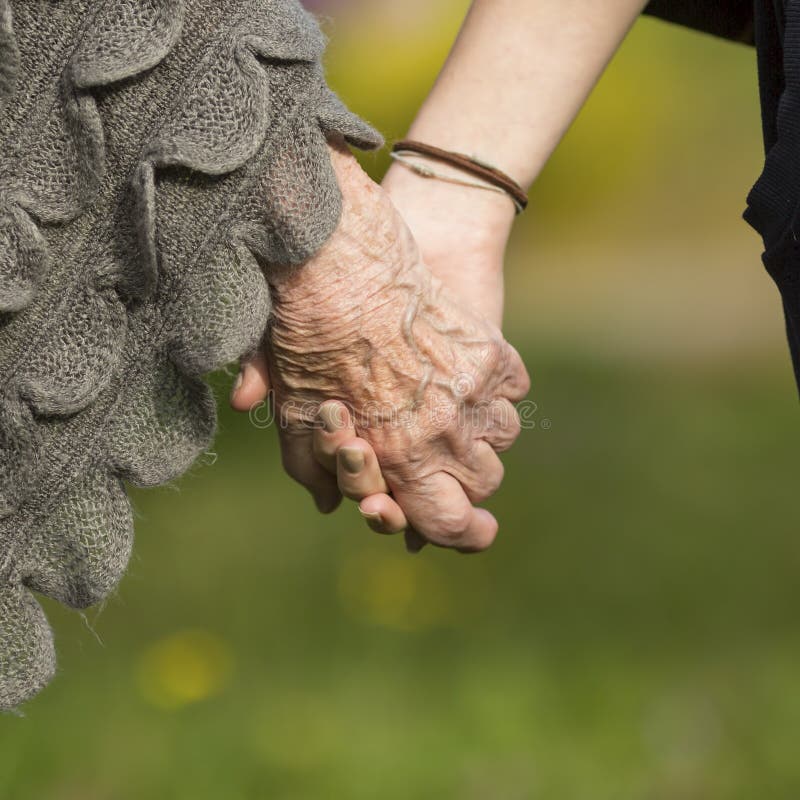 Elderly Holding a Young Hand, Close-up Hands. Stock Photo - Image of ...
