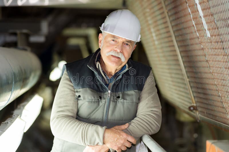 Elderly Industrial Worker Posing and Smiling Stock Photo - Image of ...