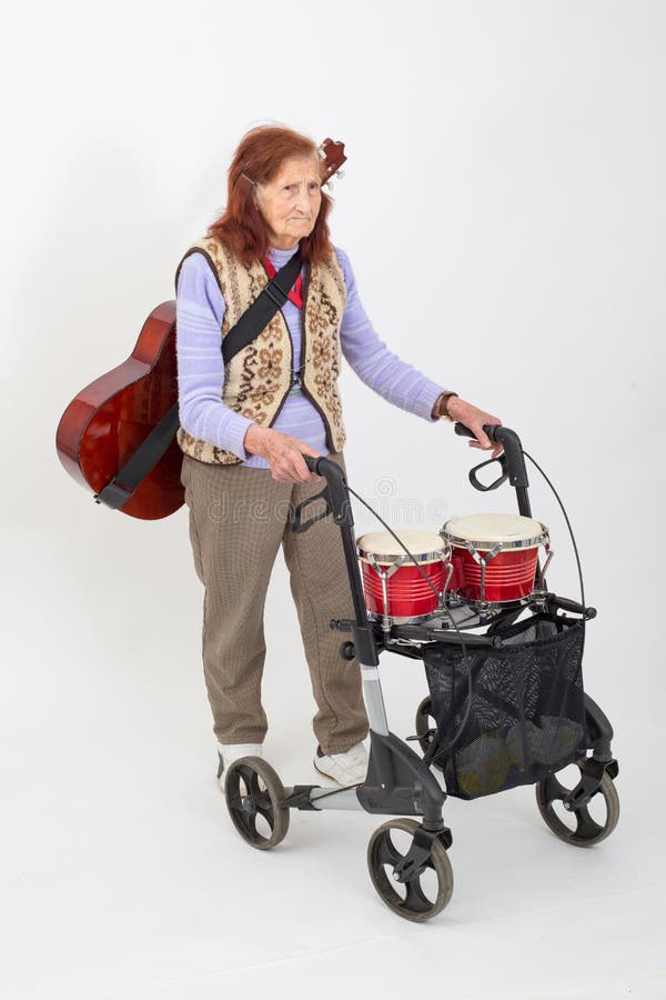 Elderly Lady with Rollator and Musical Instruments Stock Image - Image ...