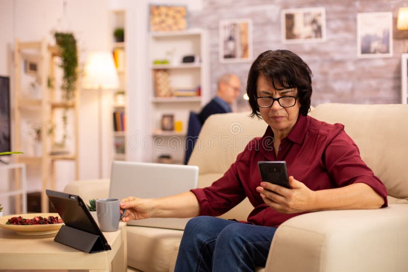 Elderly Lady Using Modern Technology in Her House Stock Photo - Image ...