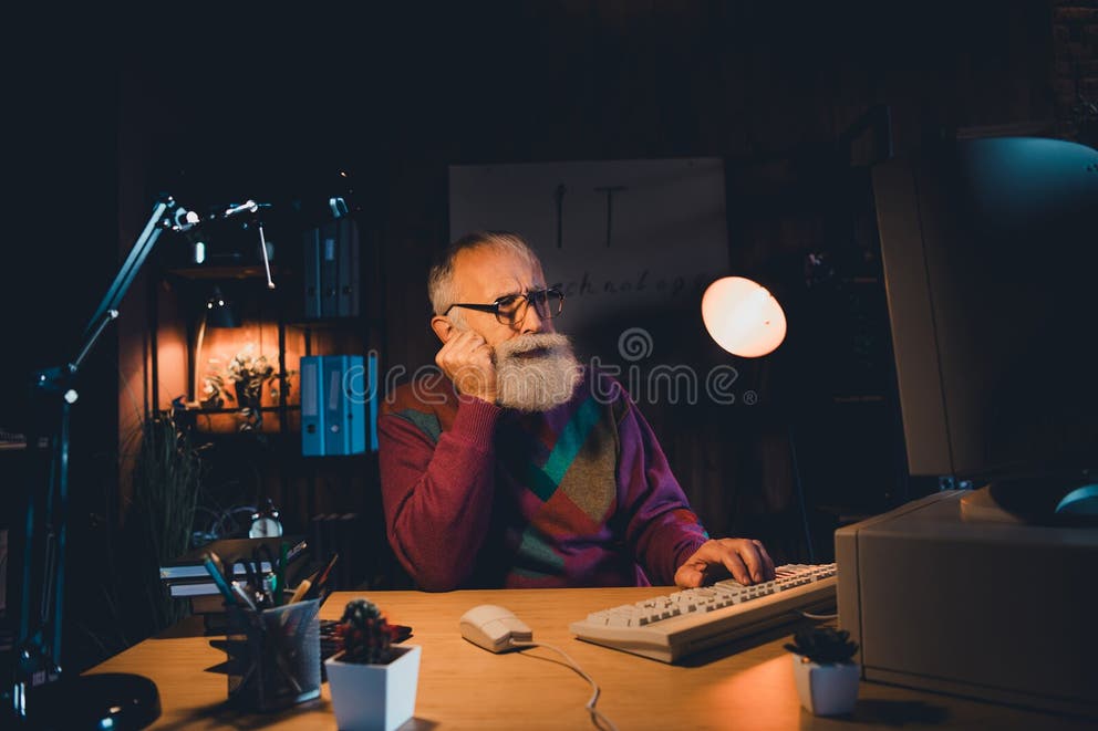 Senior Man Working at Home Office on Computer in the Evening, Exploring Programming and ...