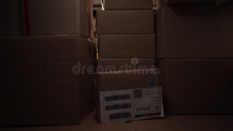 Elderly Male Warehouse Worker Puts Boxes on a Shelf Loses a Package ...