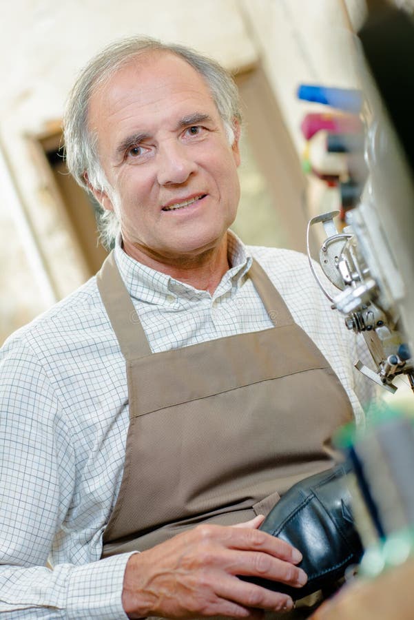 Elderly man in apron stock photo. Image of waist, trade - 132202108