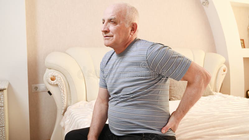 Elderly man with back pain stock image. Image of person - 217427869