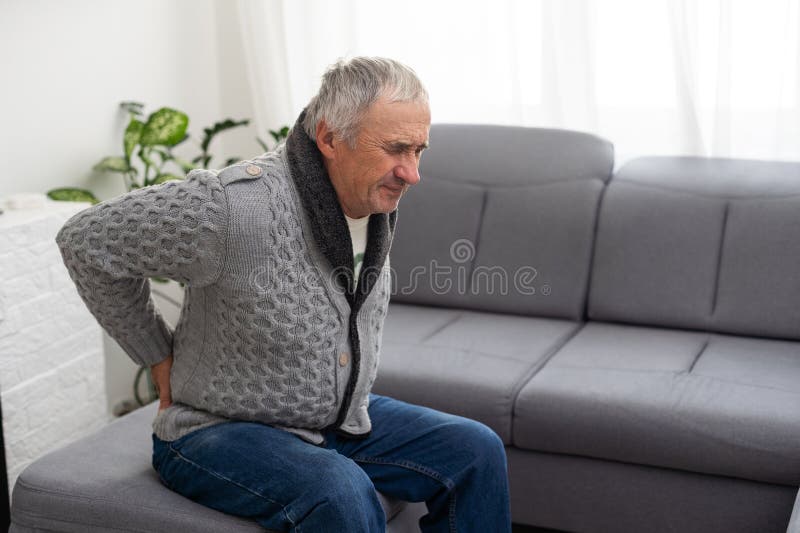 Elderly man with back pain stock image. Image of hand - 307928809