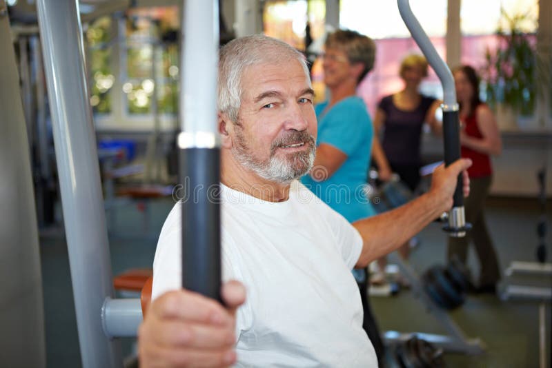 Elderly Man on Butterfly Machine Stock Photo - Image of rehab, person ...
