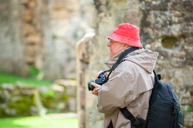 An Elderly Man with a Camera in Ancient Ruins Stock Image - Image of ...