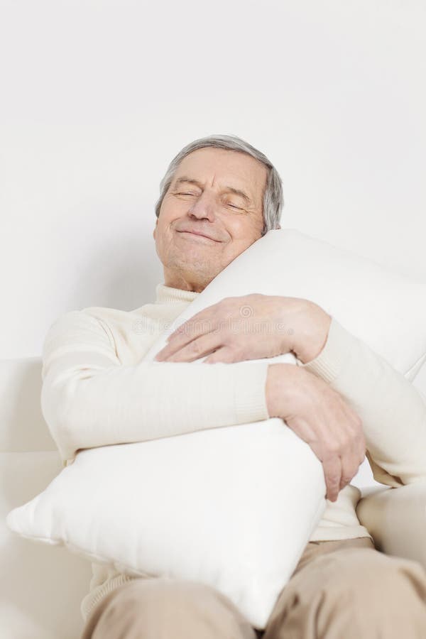 Elderly Man with a Comfortable Pillow.isolated on White Stock Photo ...