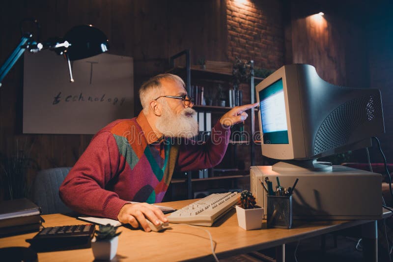 Elderly Man in Cozy Setting Using Vintage Computer Indoors during ...