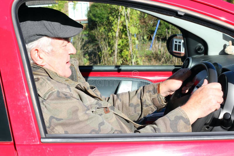 Elderly man driving a car. stock photo. Image of drive - 27458936