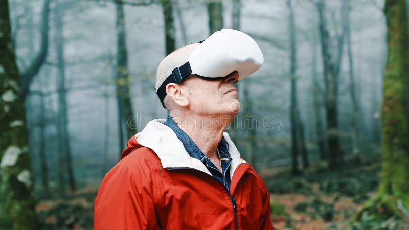 Elderly Man is Experienced the Virtual Reality in the Nature into the ...
