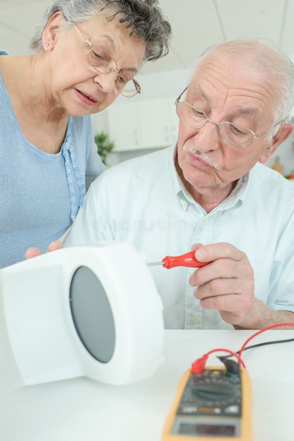 Elderly Man Fixing Coffee Machine Stock Photo - Image of voltage ...