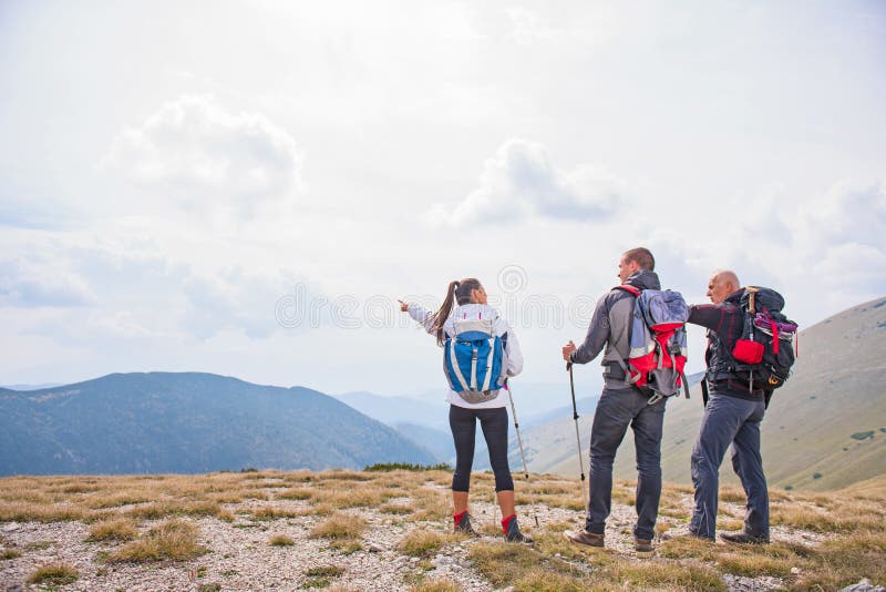 An Elderly Man Giving a Tour for a Young Group of People Stock Image ...