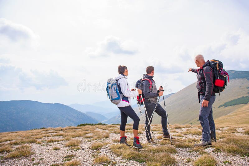 An Elderly Man Giving a Tour for a Young Group of People Stock Image ...