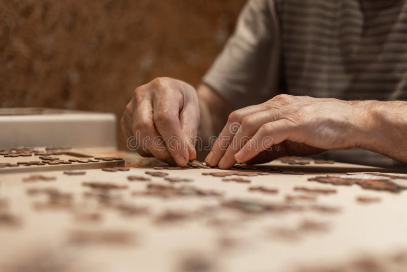 Elderly Man Hands Doing Jigsaw Puzzle at Home Stock Photo - Image of ...