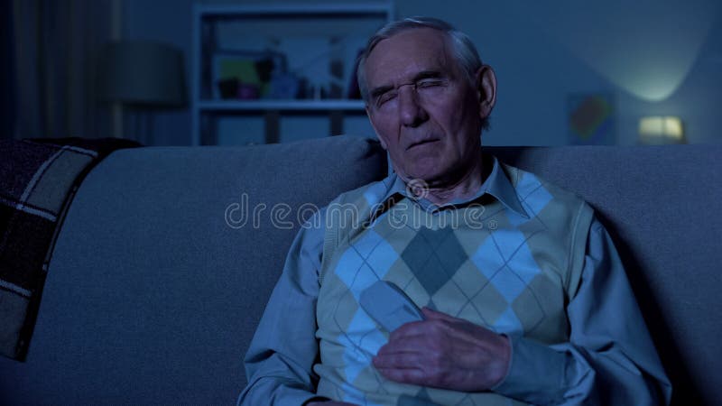 Elderly Man Holding Remote Controller Sleeping in Front of TV, Evening ...