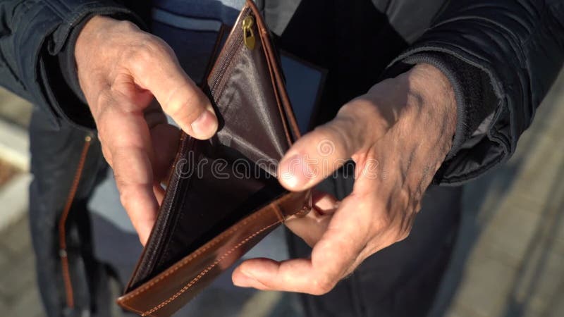An Elderly Man Holds an Empty Purse. the Concept of Poverty in ...