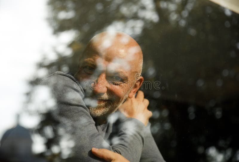 Happy Senior Man Beard Hugging Himself Smiling Window Stock Photos ...