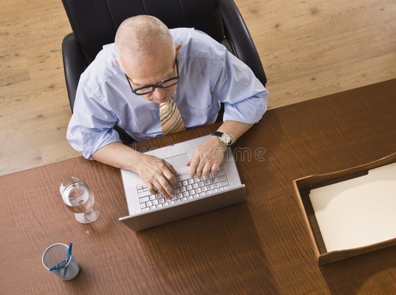 Elderly man on Laptop stock photo. Image of sitting, technology - 10011408