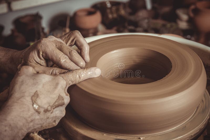 Elderly Man Making Pot Using Pottery Wheel in Studio Stock Photo ...