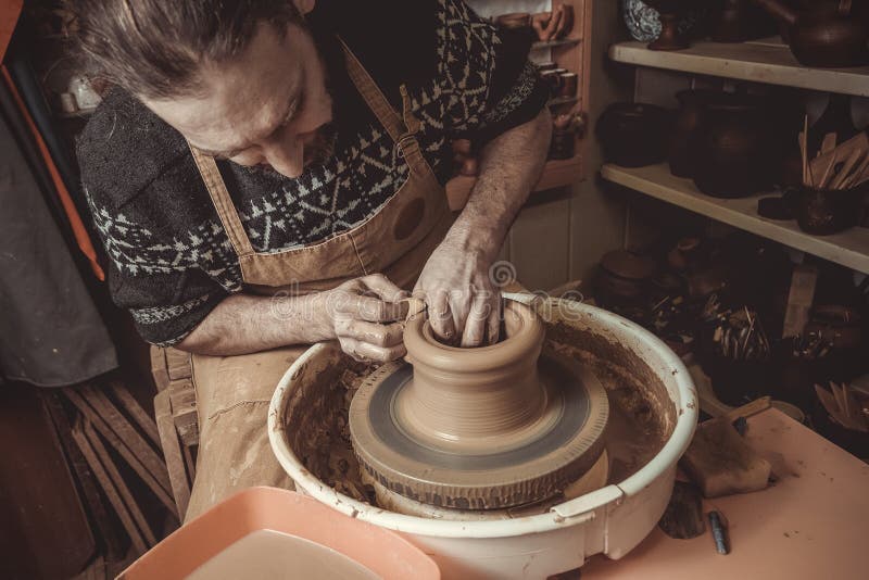 Elderly Man Making Pot Using Pottery Wheel in Studio Stock Photo ...