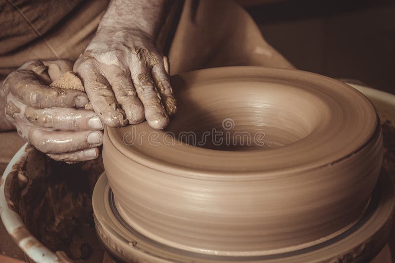 Elderly Man Making Pot Using Pottery Wheel in Studio Stock Photo ...