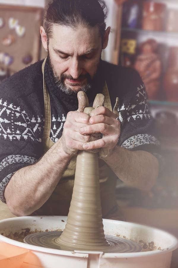 Elderly Man Making Pot Using Pottery Wheel in Studio Stock Photo ...