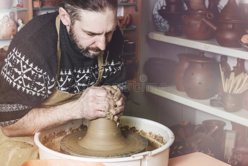 Elderly Man Making Pot Using Pottery Wheel in Studio Stock Photo ...
