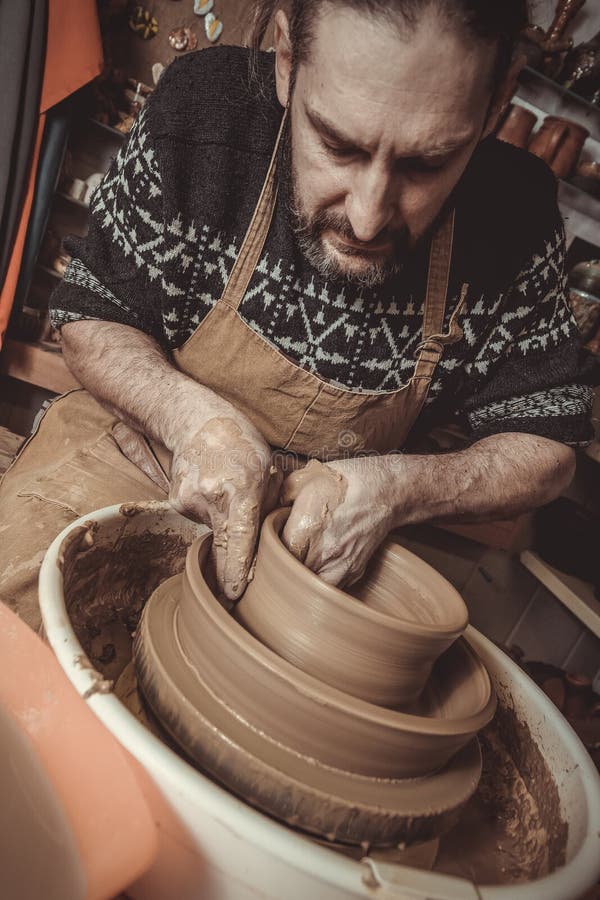 Elderly Man Making Pot Using Pottery Wheel in Studio Stock Photo ...