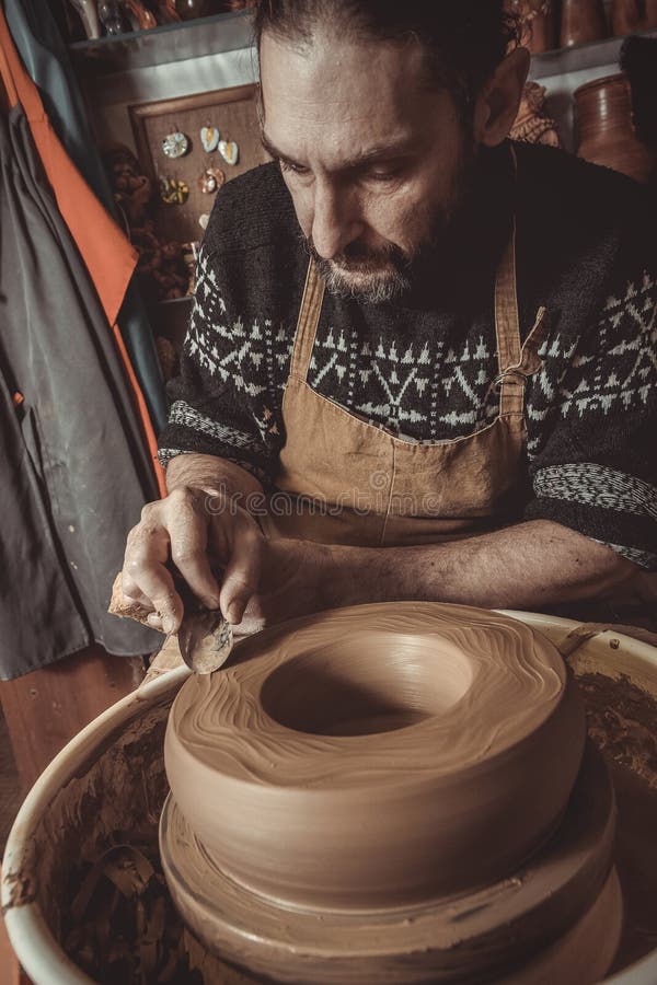 Elderly Man Making Pot Using Pottery Wheel in Studio Stock Image ...