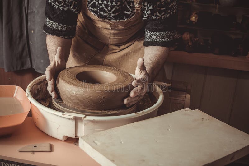 Elderly Man Making Pot Using Pottery Wheel in Studio Stock Photo ...