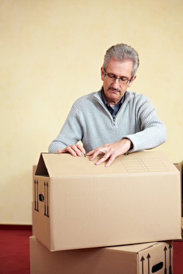Elderly Man Opening Packing Case Stock Image - Image of boxes, close ...
