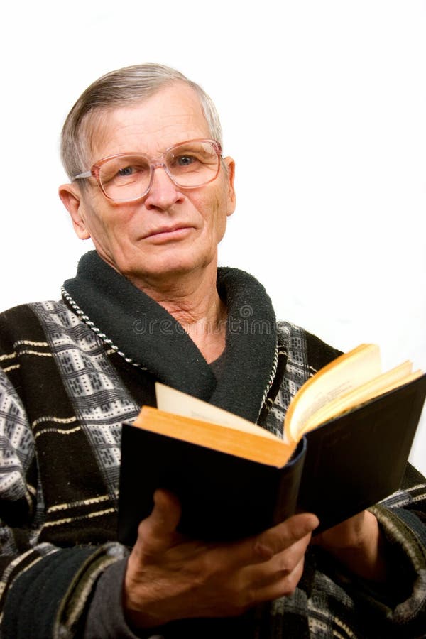 Elderly man reading a book stock photo. Image of grandparent - 7859910