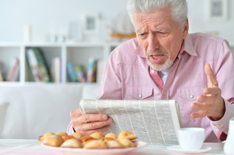 Sad Man Reading Newspaper Stock Photos - Free & Royalty-Free Stock ...