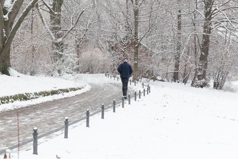 Elderly Man is Running in the Snow in the Park Stock Image - Image of ...