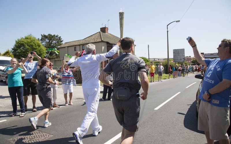 Man running with torch editorial photo. Image of olympics - 28077996