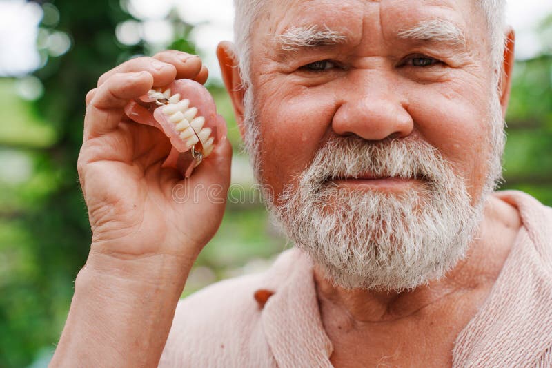 The Elderly Man& X27;s Hold a False Jaw. Stock Photo - Image of food ...