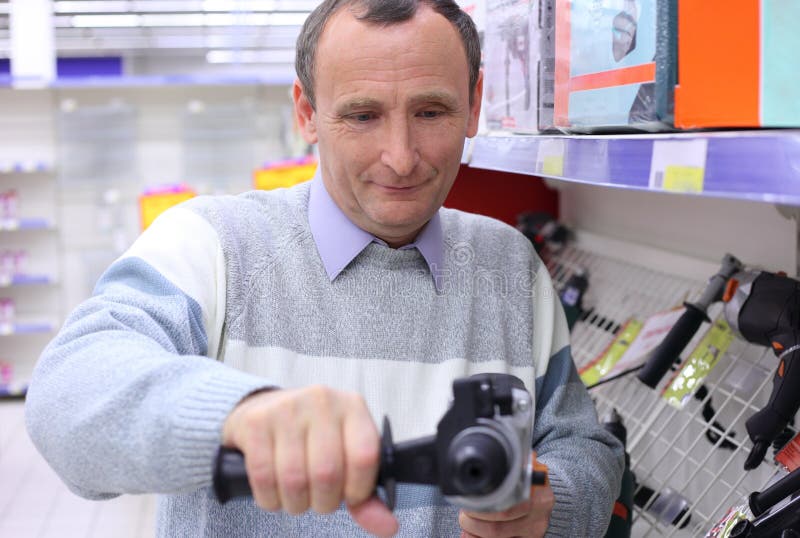 Elderly Man with Boy in Shop with Hammers Stock Photo - Image of ...