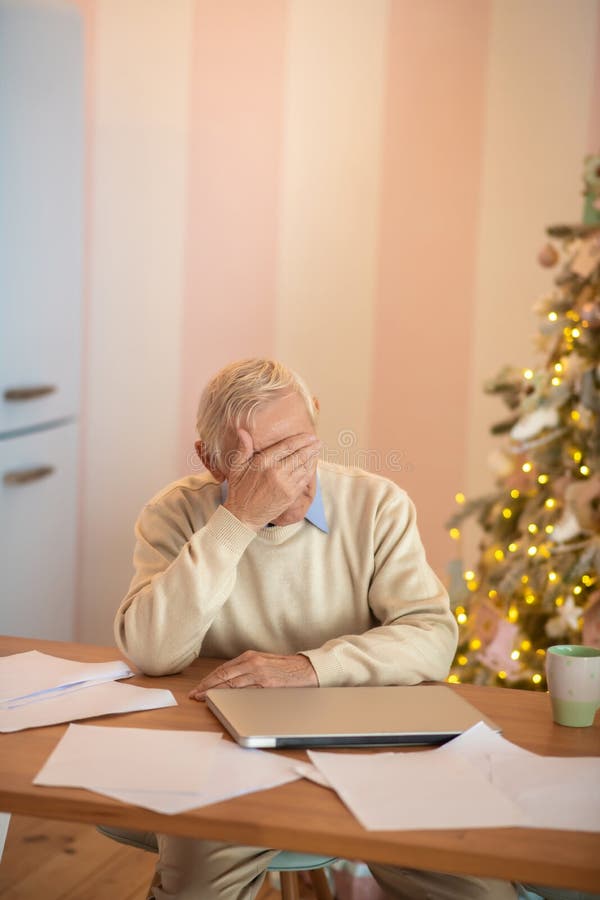 Elderly Man Sitting at the Table and Feeling Tired Stock Photo - Image ...