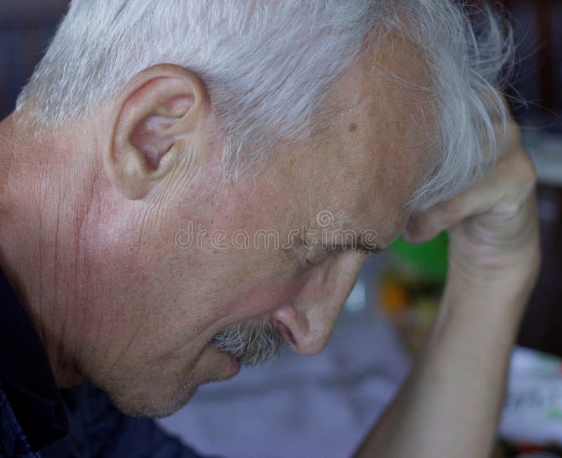 An Elderly Man is Sitting at a Table, Thinking Stock Photo - Image of ...