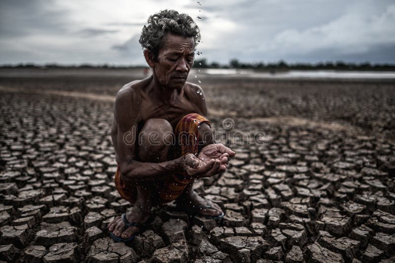 An Elderly Man Sitting in Touch with Rain in the Dry Season, Global ...