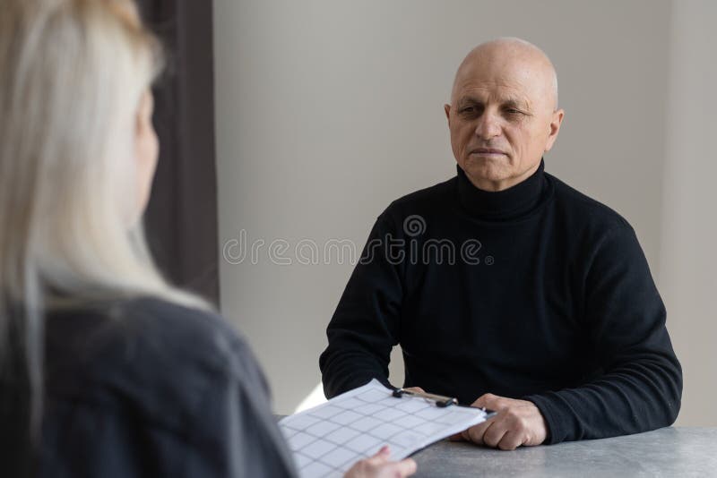 Elderly Man Talking with Female Manager about Opening Saving Account ...