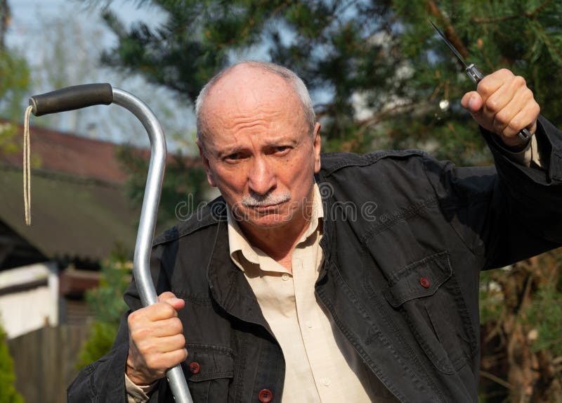 Elderly Man Threatening with a Cane Stock Image - Image of mature ...