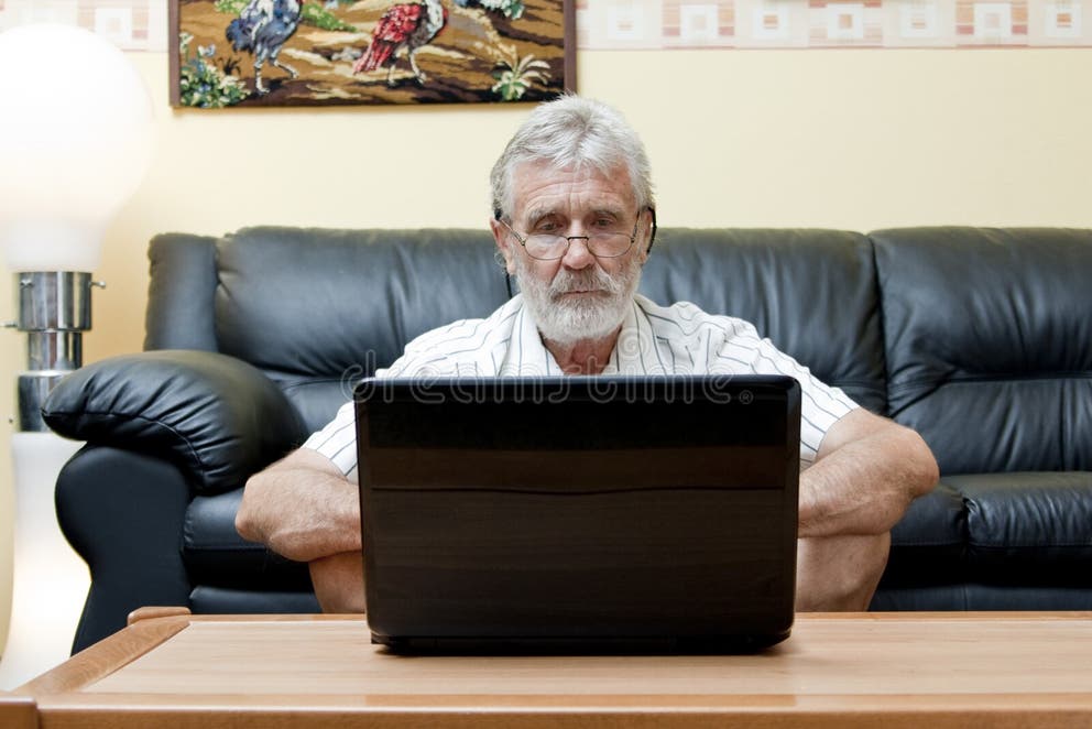 Elderly man using computer stock photo. Image of monitor - 20132150