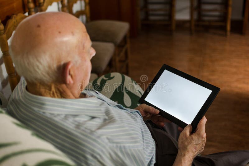 Elderly Man is Using a Digital Tablet at Home Stock Image - Image of ...