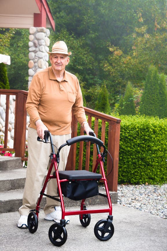 Elderly Man with Walker stock photo. Image of foliage - 26760304