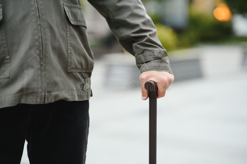 Elderly Man Walks with a Cane in a City Spring Park. Stock Image ...