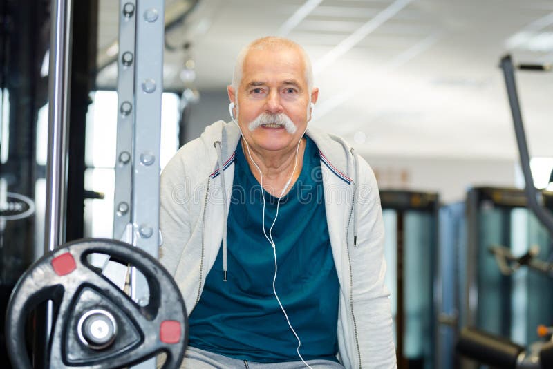Elderly Man on Weight Machine in Gym Stock Photo - Image of build ...
