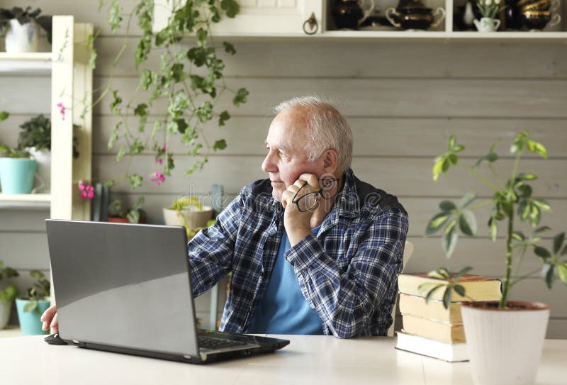 Elderly Man Working on Computer while Sitting at Home Stock Photo ...
