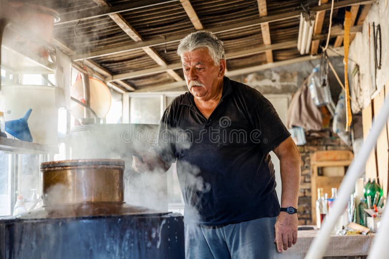 Elderly Man in Workshop with Distillery Equipment Stock Image - Image ...